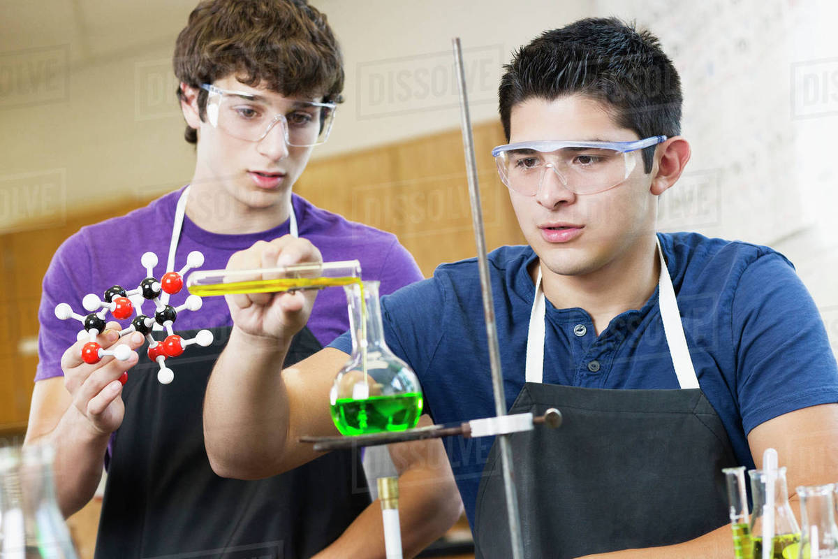 Students working with chemicals in classroom - Royalty-free Stock Photo ...