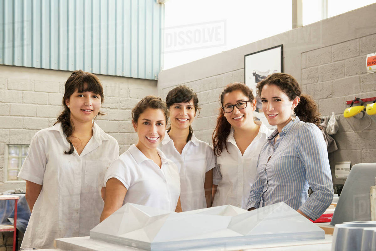 Workers smiling in manufacturing plant - Royalty-free Stock Photo ...