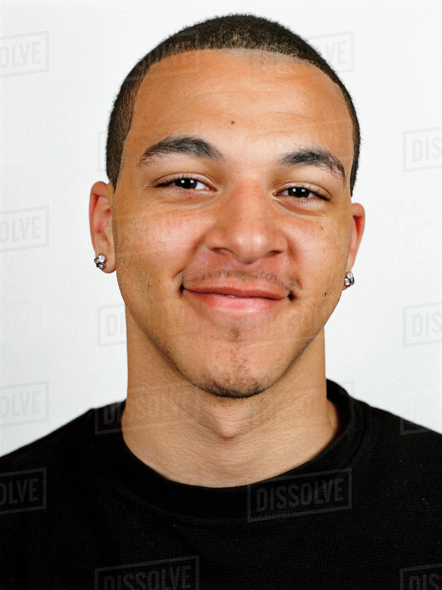 Mixed race man smiling - Royalty-free Stock Photo | Dissolve