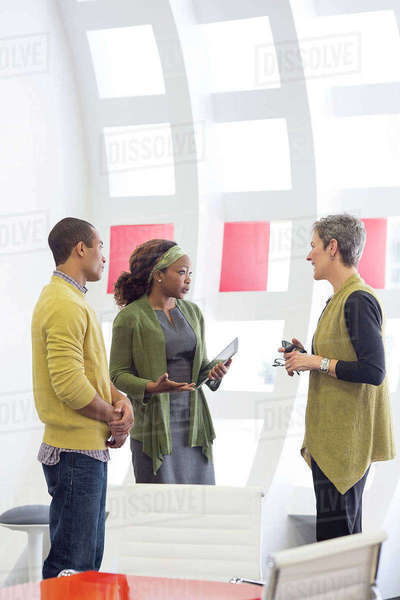 Business people talking in office - Royalty-free Stock Photo | Dissolve