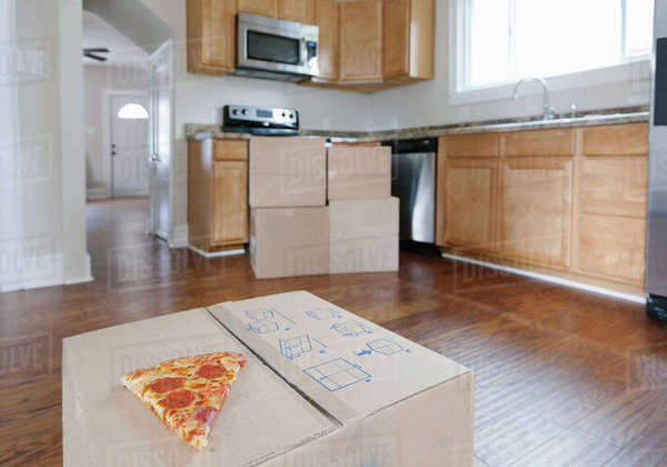 Boxes and cartons stacked in a house - Royalty-free Stock Photo | Dissolve