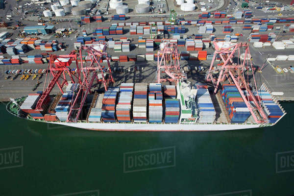 Cargo containers on commercial dock - Royalty-free Stock Photo | Dissolve