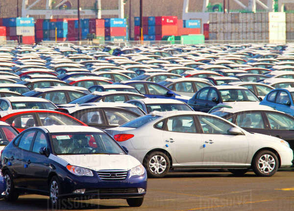 Cars parked on commercial dock - Royalty-free Stock Photo | Dissolve