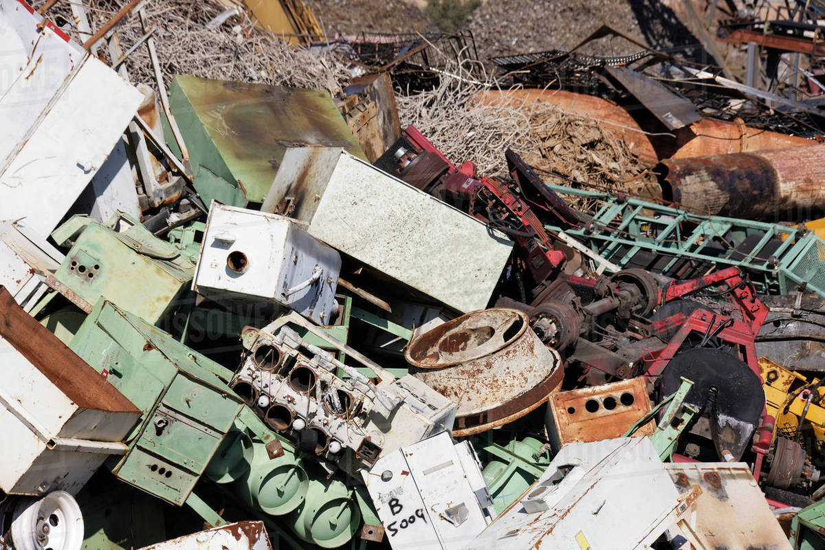 Scrap Metal in Scrap Yard - Stock Photo - Dissolve
