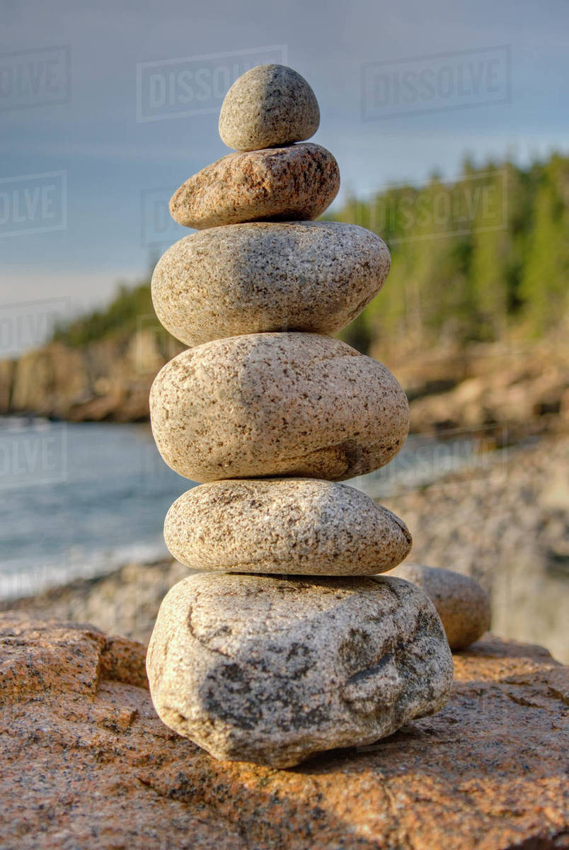 A pile of smooth rounded stacked stones - Stock Photo - Dissolve