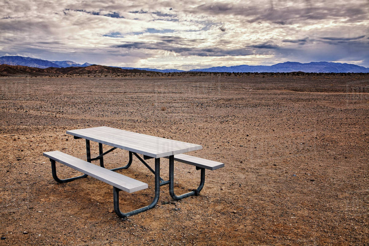Picnic table in the desert - Royalty-free Stock Photo | Dissolve