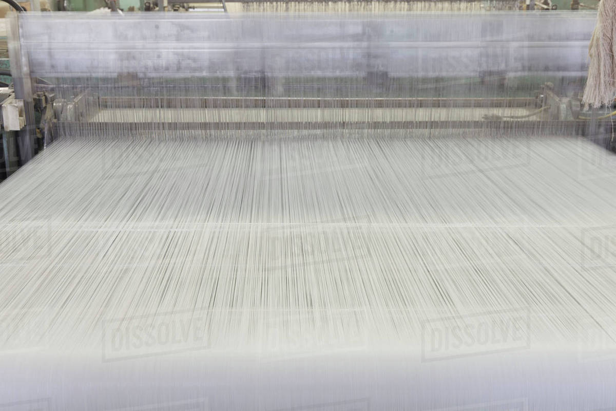 Industrial loom in textile factory - Royalty-free Stock Photo | Dissolve