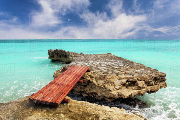 Wooden bridge across rocks on the coastline - Royalty-free Stock Photo ...