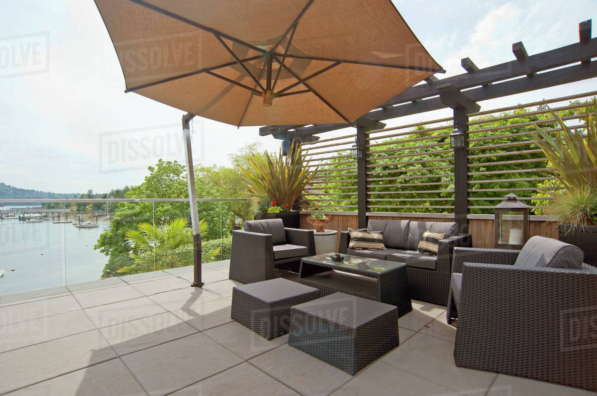 A house terrace overlooking the water - Royalty-free Stock Photo | Dissolve