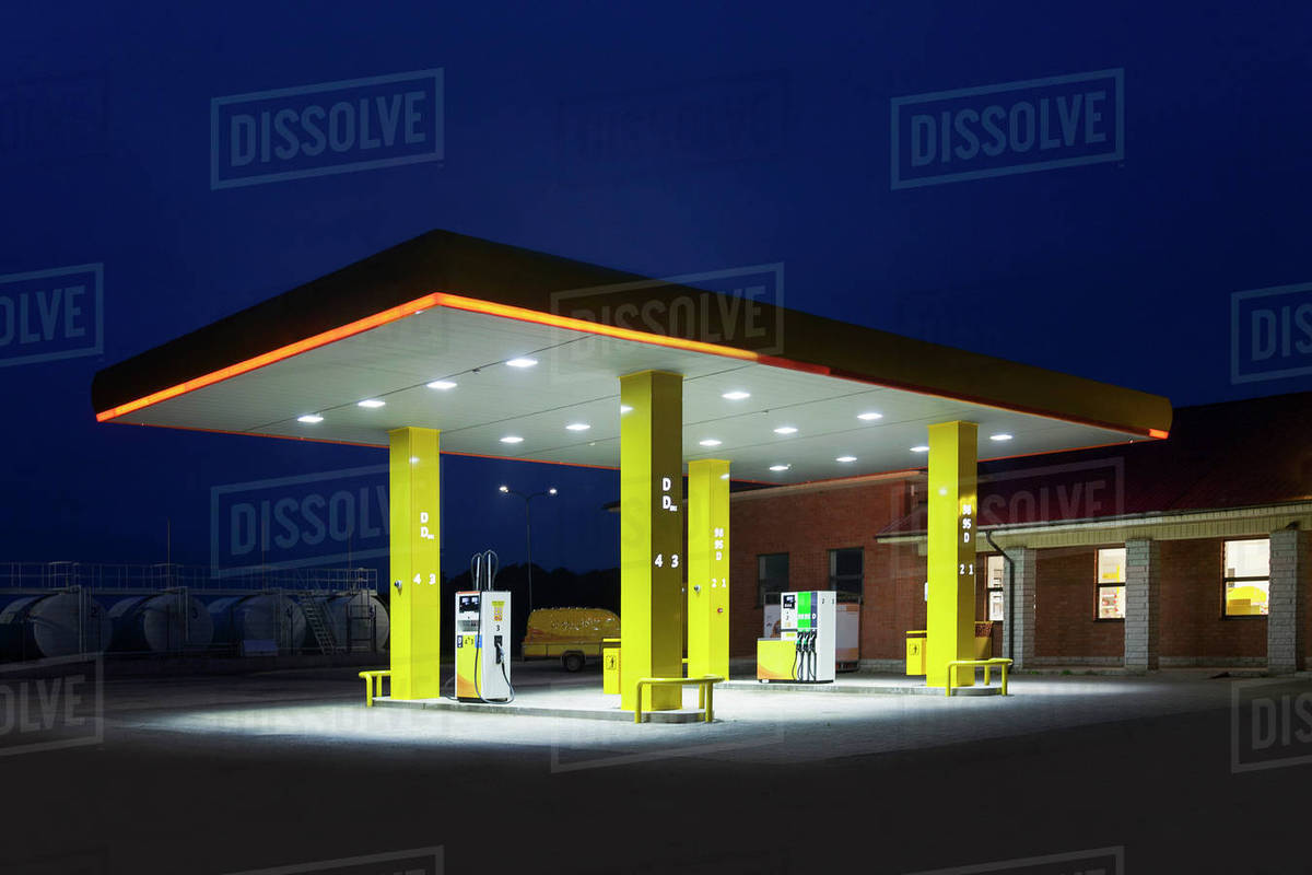 A roadside garage at night - Stock Photo - Dissolve