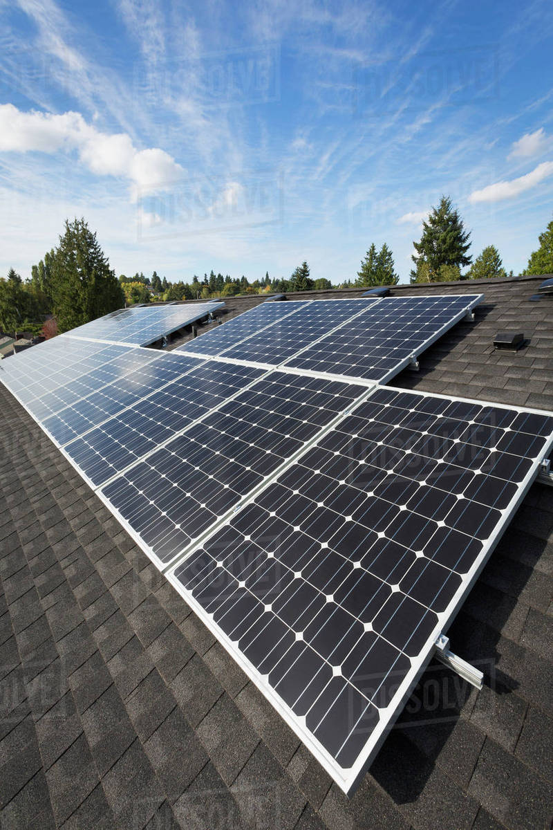 Solar panels fixed on the rooftop of a house - Royalty-free Stock Photo ...