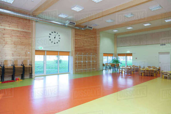 A large open hall, with a large clock on the wall - Royalty-free Stock ...