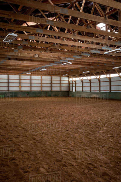 Empty indoor horse riding ring - Royalty-free Stock Photo | Dissolve