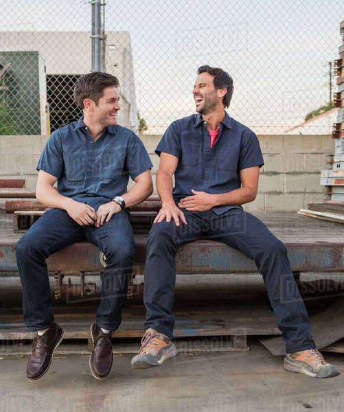 Men talking outdoors - Stock Photo - Dissolve