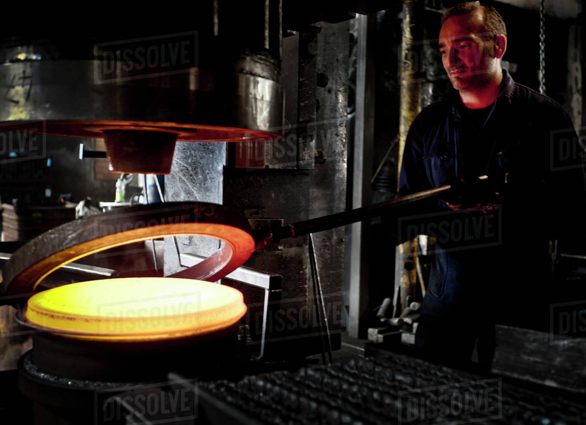 Caucasian worker melting steel in factory - Royalty-free Stock Photo ...