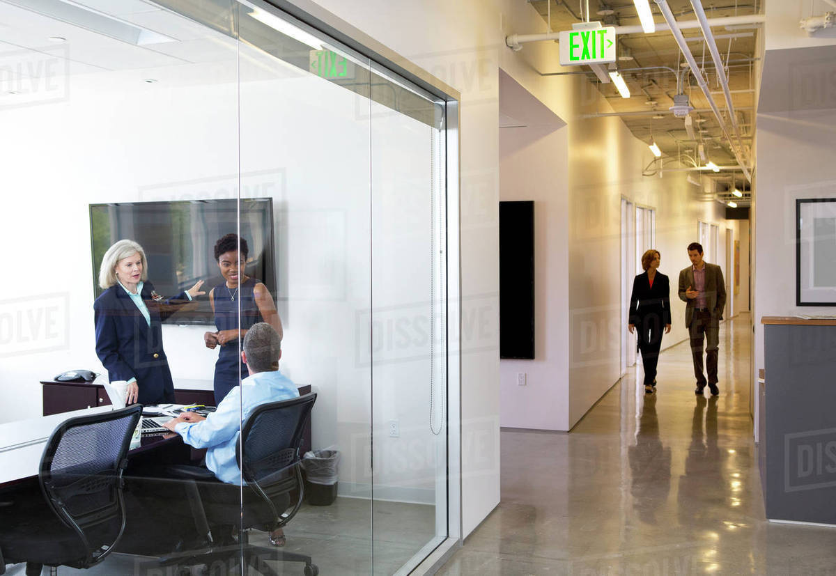 Business people talking in office - Royalty-free Stock Photo | Dissolve