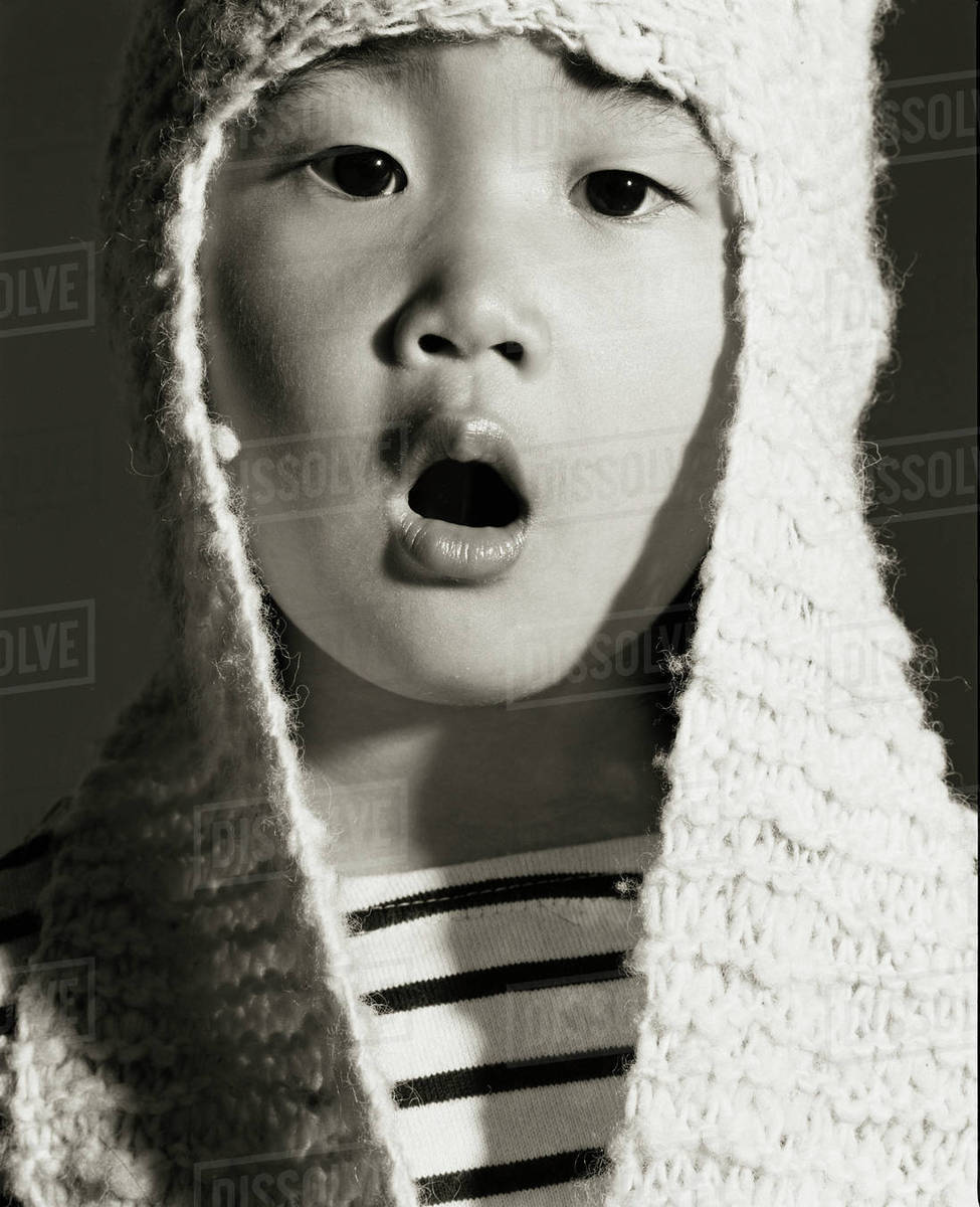 Asian girl wearing knitted cap - Stock Photo - Dissolve