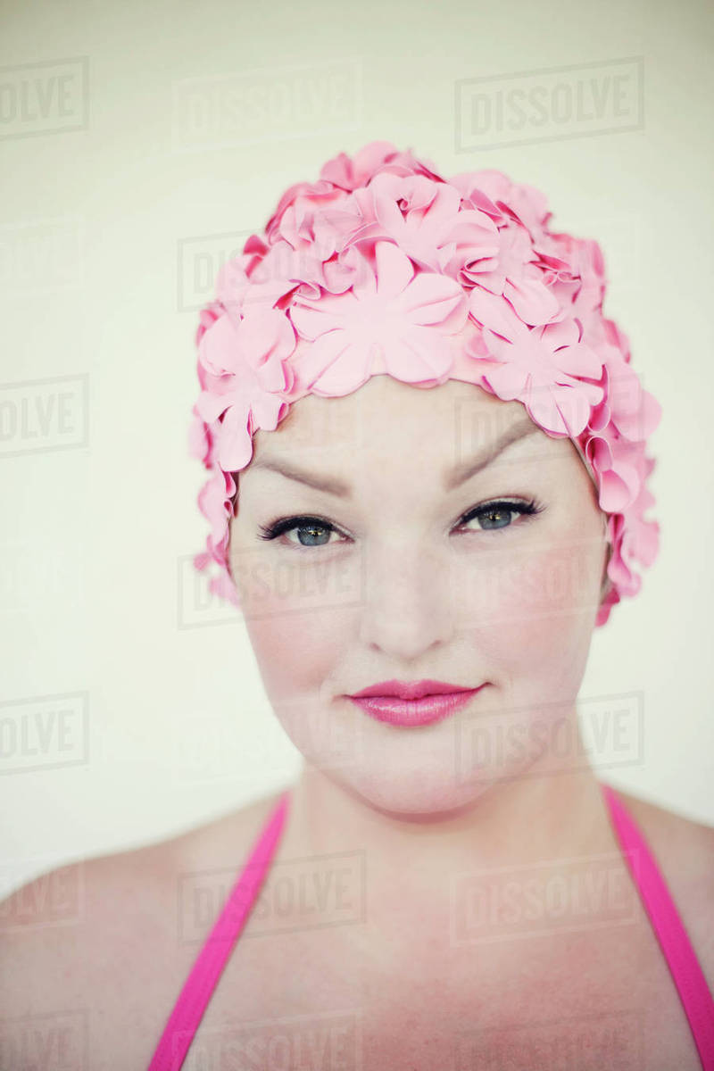 Woman wearing swim cap and bathing suit - Stock Photo - Dissolve