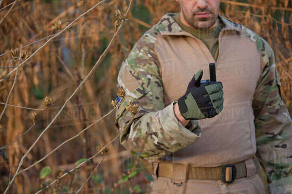 Soldier holding walkie-talkie during training - Royalty-free Stock ...