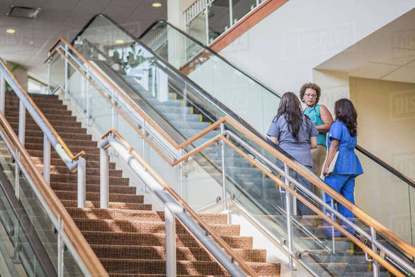Nurses and doctor on hospital steps - Stock Photo - Dissolve