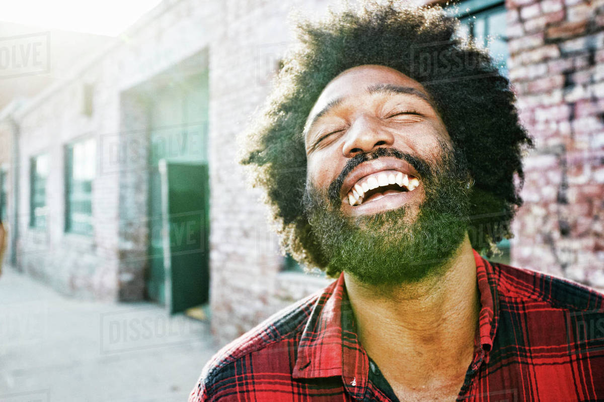 Mixed race man smiling outdoors - Royalty-free Stock Photo | Dissolve