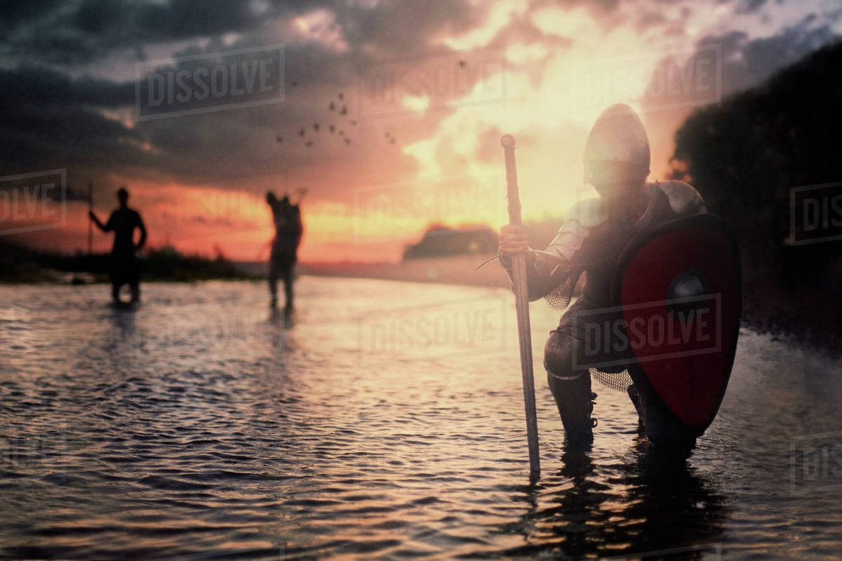 Caucasian soldiers standing in river - Royalty-free Stock Photo | Dissolve