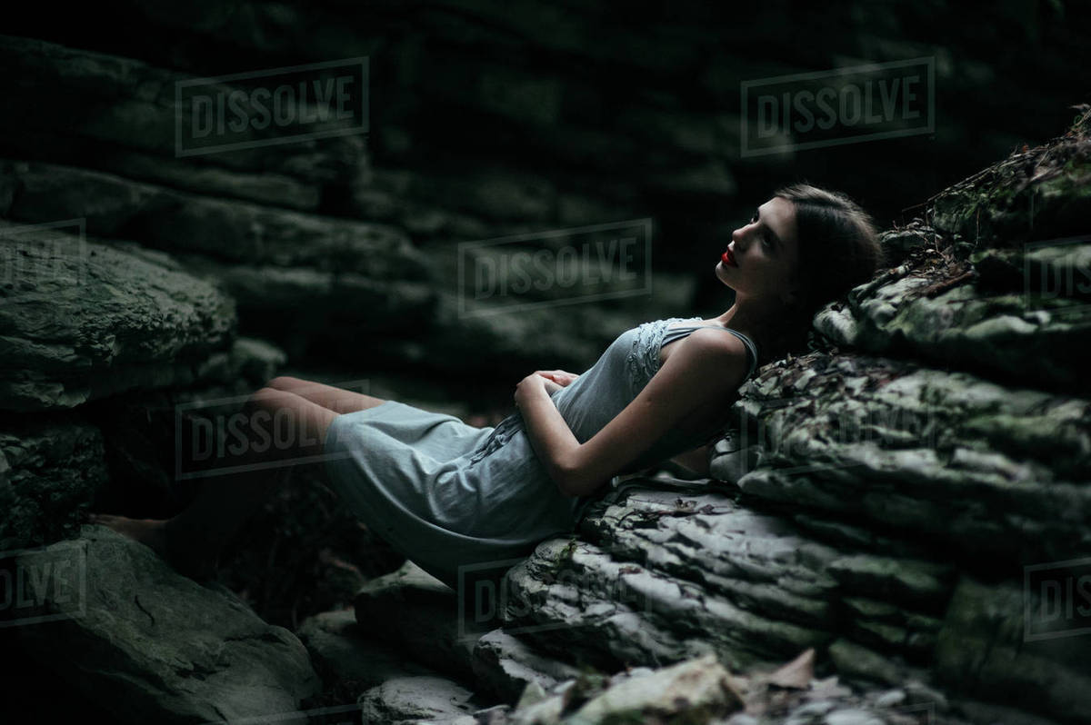 Caucasian woman laying on rock formation - Royalty-free Stock Photo ...