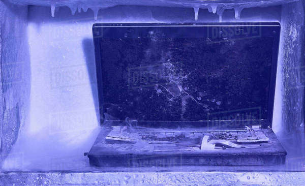 Frozen broken laptop computer - Royalty-free Stock Photo | Dissolve