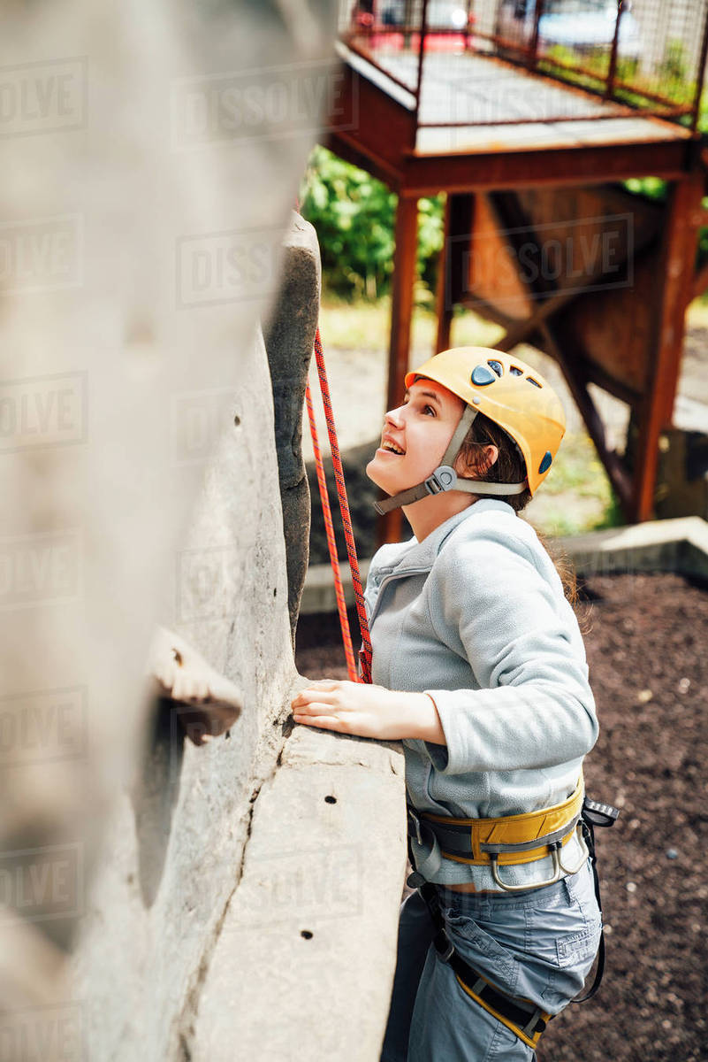 Caucasian woman climbing rock climbing wall - Royalty-free Stock Photo ...