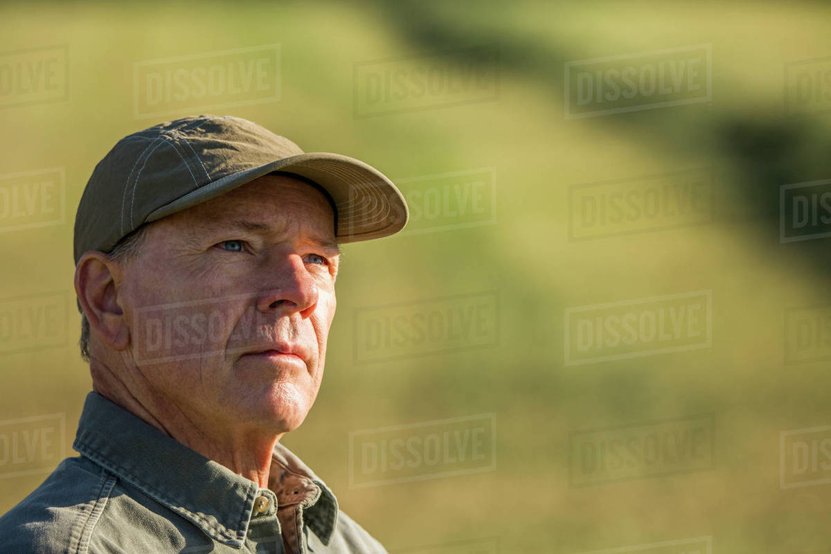 Pensive Caucasian farmer - Stock Photo - Dissolve
