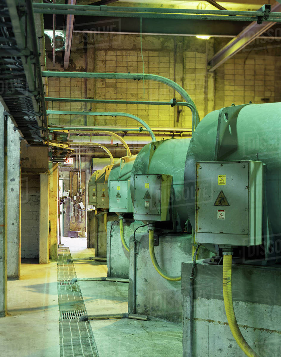 Machinery in a row in factory - Royalty-free Stock Photo | Dissolve