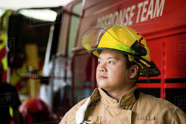Chinese fireman standing near fire truck - Royalty-free Stock Photo ...