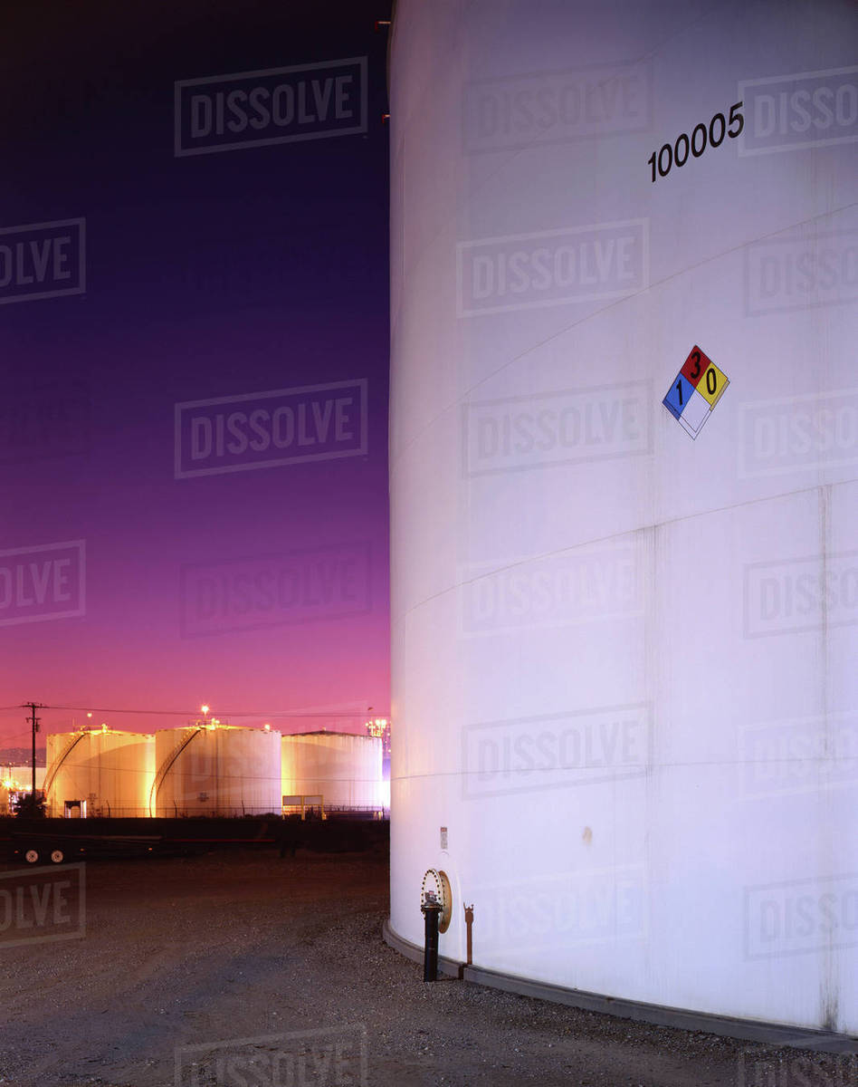 Storage tanks at night - Royalty-free Stock Photo | Dissolve