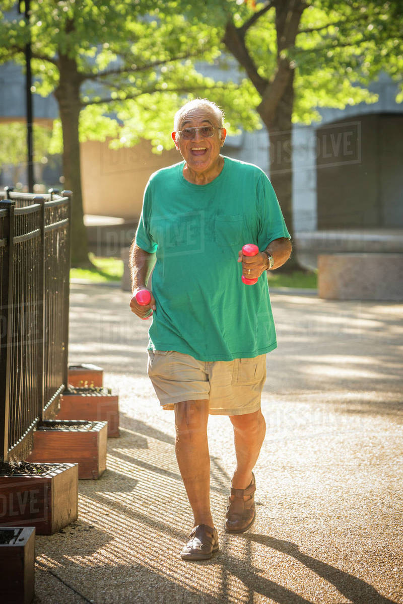 Man walking in park - Royalty-free Stock Photo | Dissolve