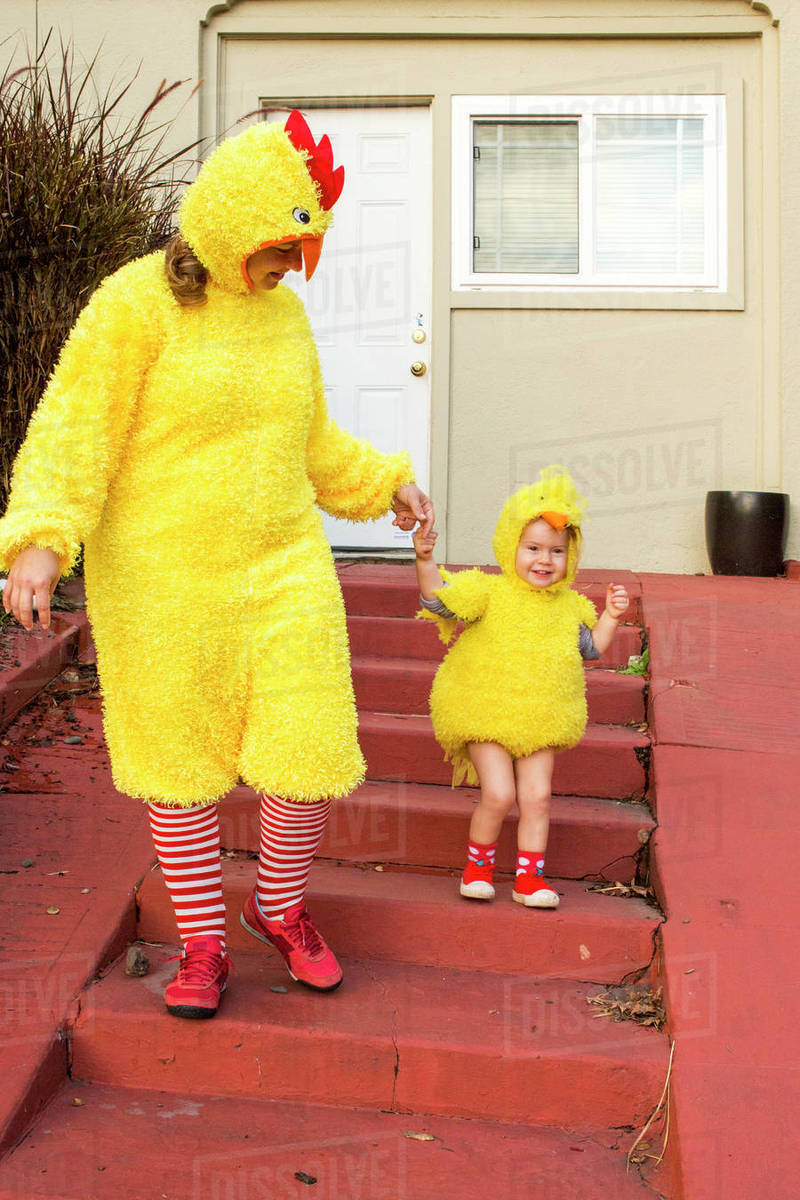 Caucasian mother and daughter wearing chicken costumes - Stock Photo ...