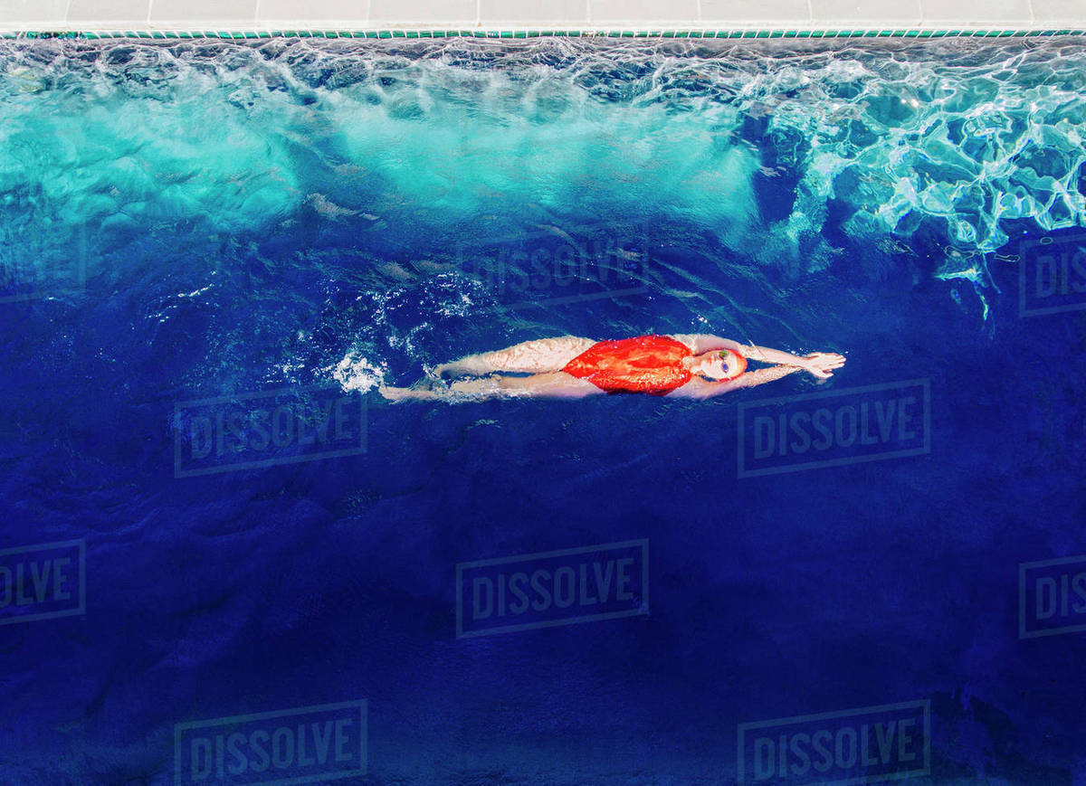 Caucasian woman swimming in swimming pool - Royalty-free Stock Photo ...