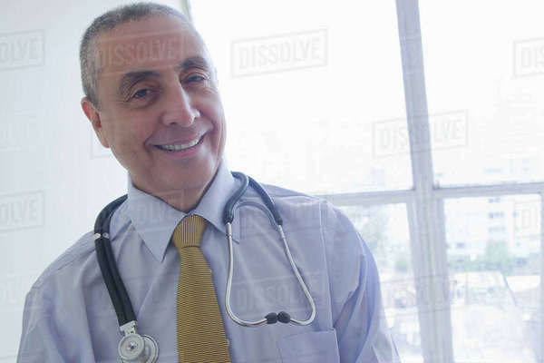 Smiling Hispanic doctor - Royalty-free Stock Photo | Dissolve