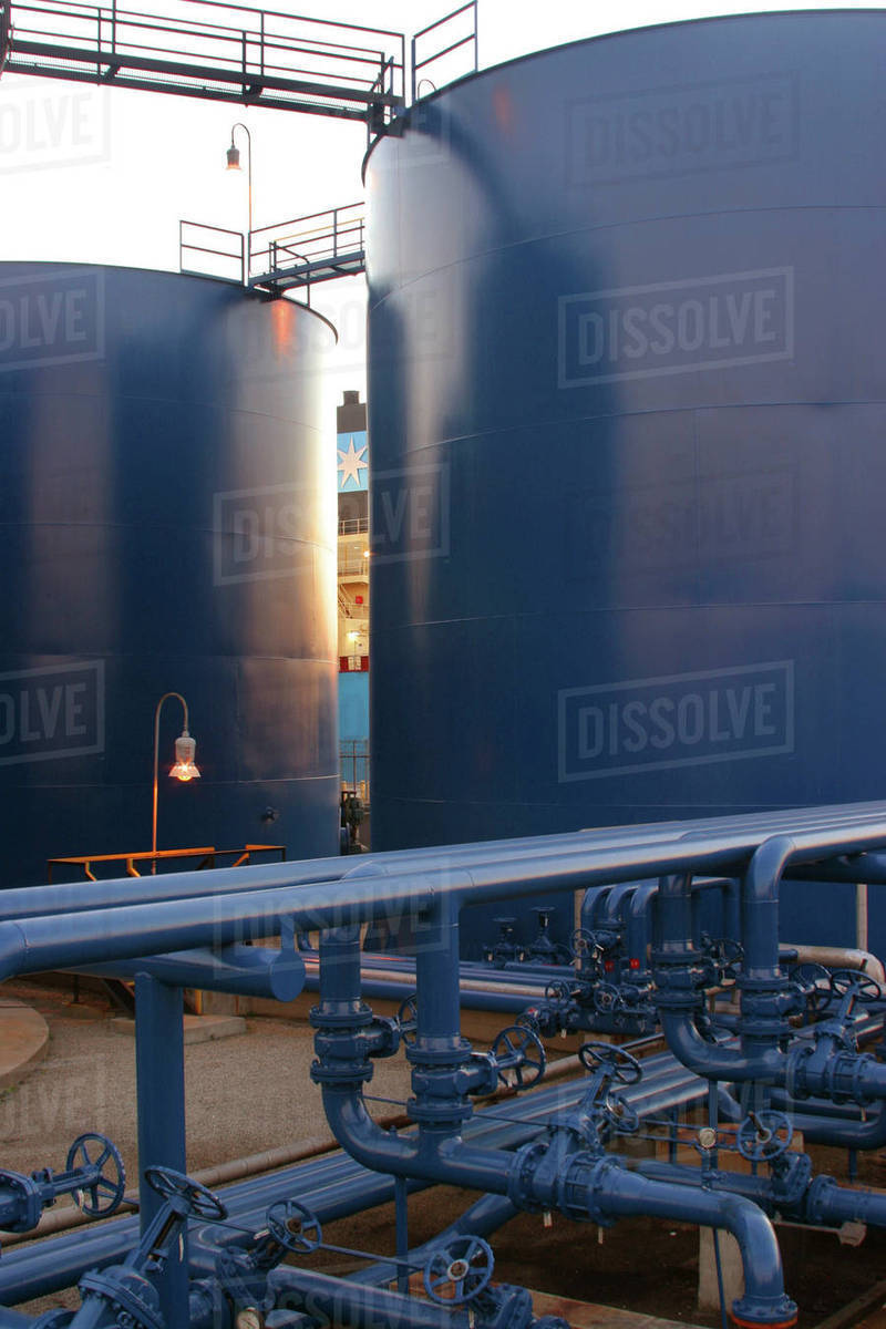 Blue pipes and storage tanks - Royalty-free Stock Photo | Dissolve