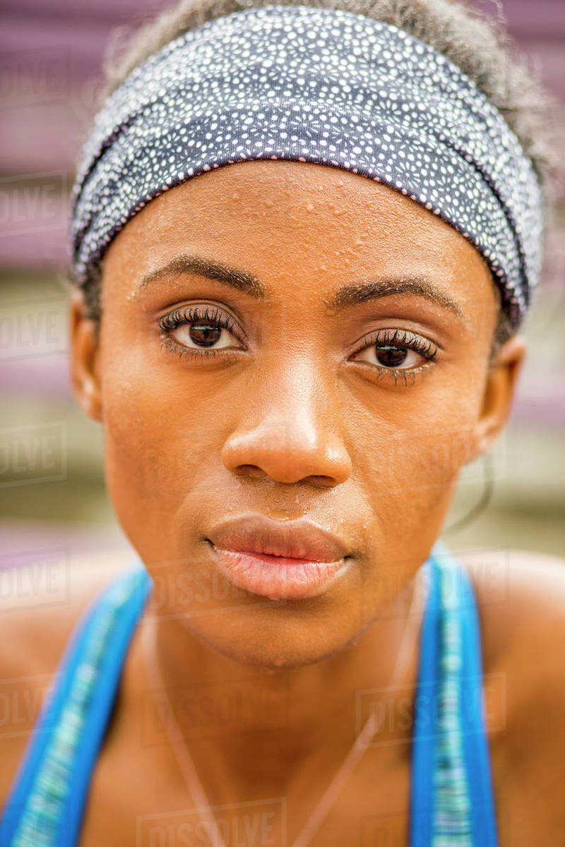 Serious Black woman sweating - Royalty-free Stock Photo | Dissolve