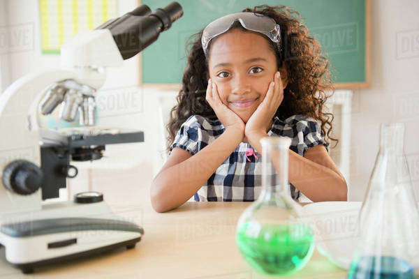 Mixed race student smiling in chemistry lab - Royalty-free Stock Photo ...
