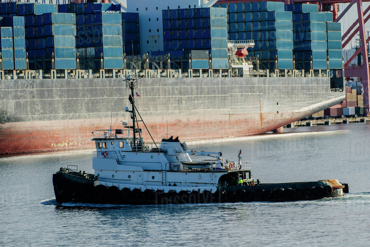 Tugboat in harbor at shipping port - Royalty-free Stock Photo | Dissolve