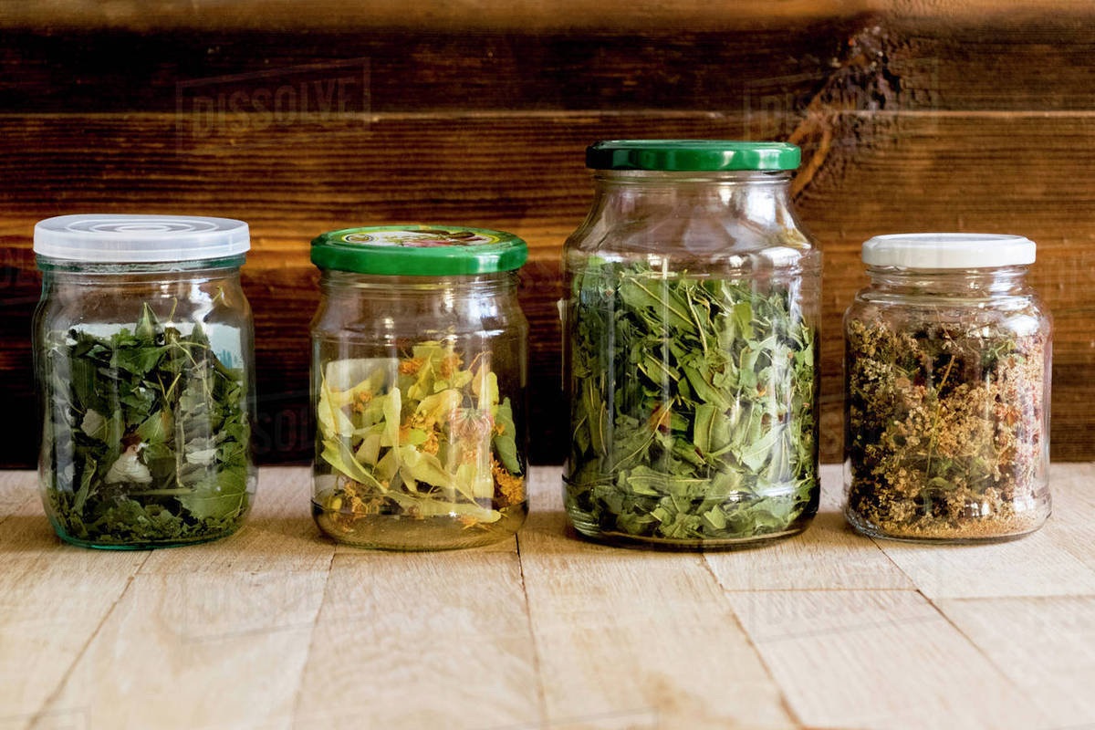 Row of jars of tea leaves - Stock Photo - Dissolve