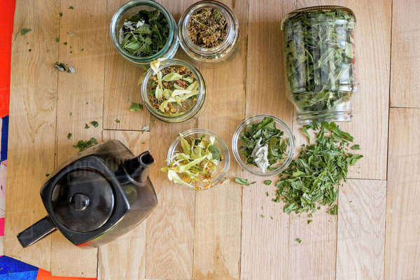 Teapot and tea leaves on table - Royalty-free Stock Photo | Dissolve