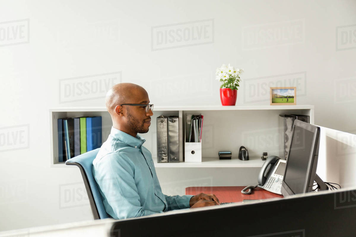 African American man using computer in office - Royalty-free Stock ...