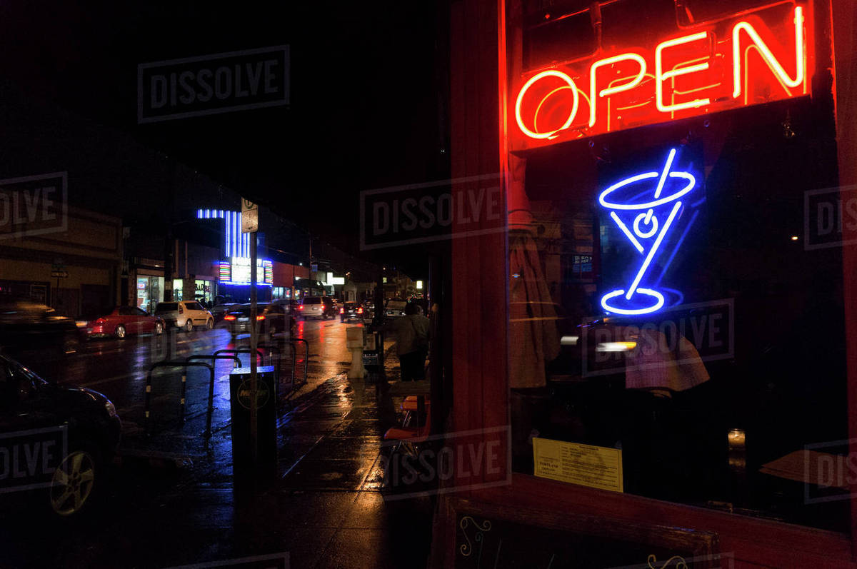 Neon sign in bar window at night - Stock Photo - Dissolve