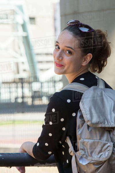 Portrait of smiling Caucasian teenage girl carrying backpack - Royalty ...