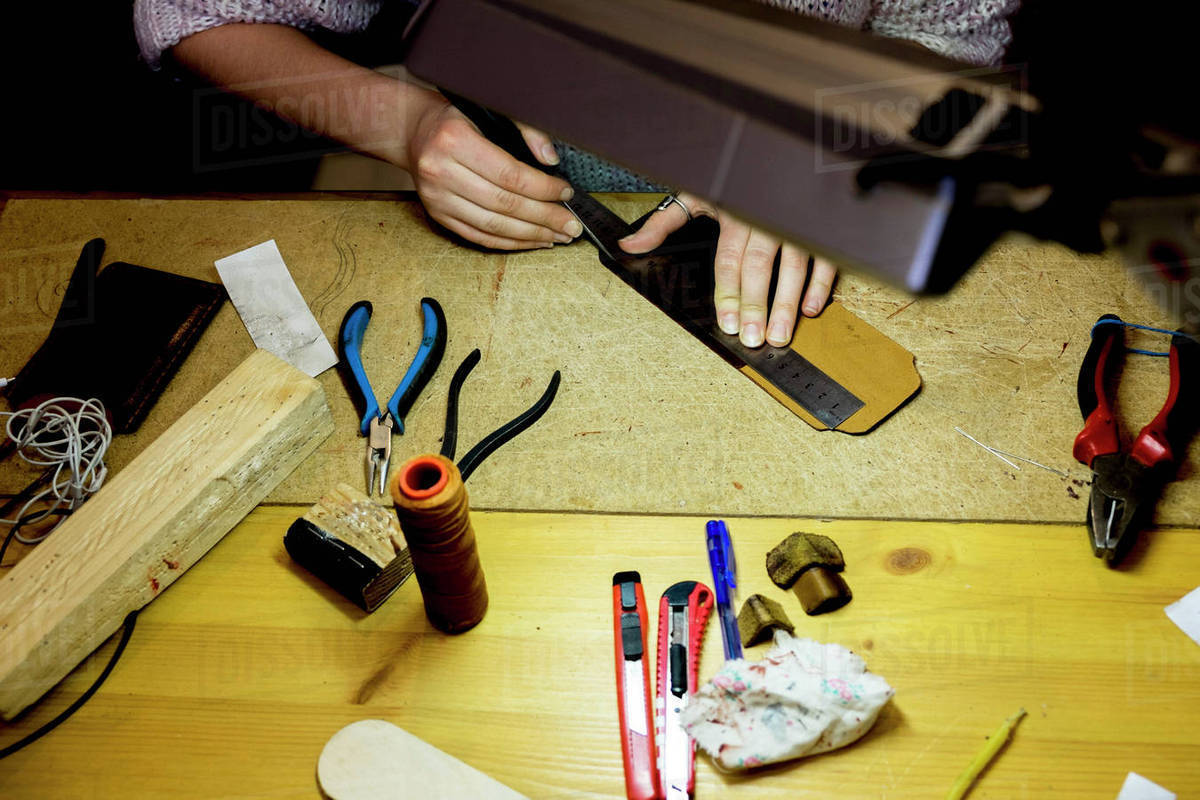 Hands of Caucasian man using ruler in workshop - Royalty-free Stock ...