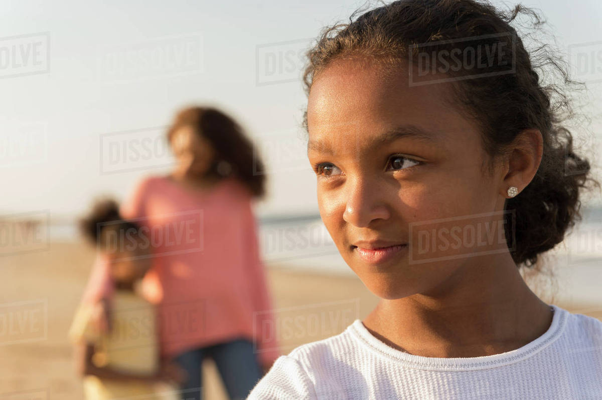 Portrait of confident girl at beach - Royalty-free Stock Photo | Dissolve