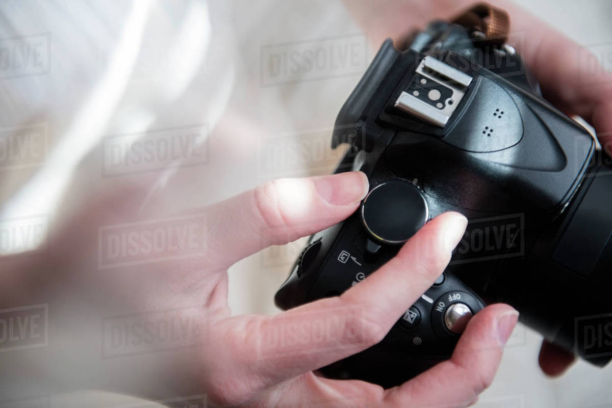 Hands of Caucasian woman turning dial on camera - Royalty-free Stock ...