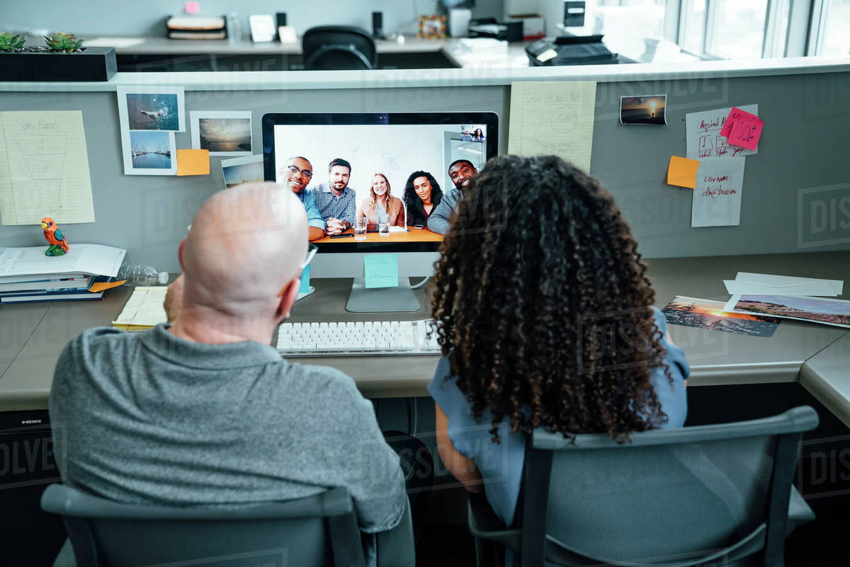 Business people on video conference - Stock Photo - Dissolve